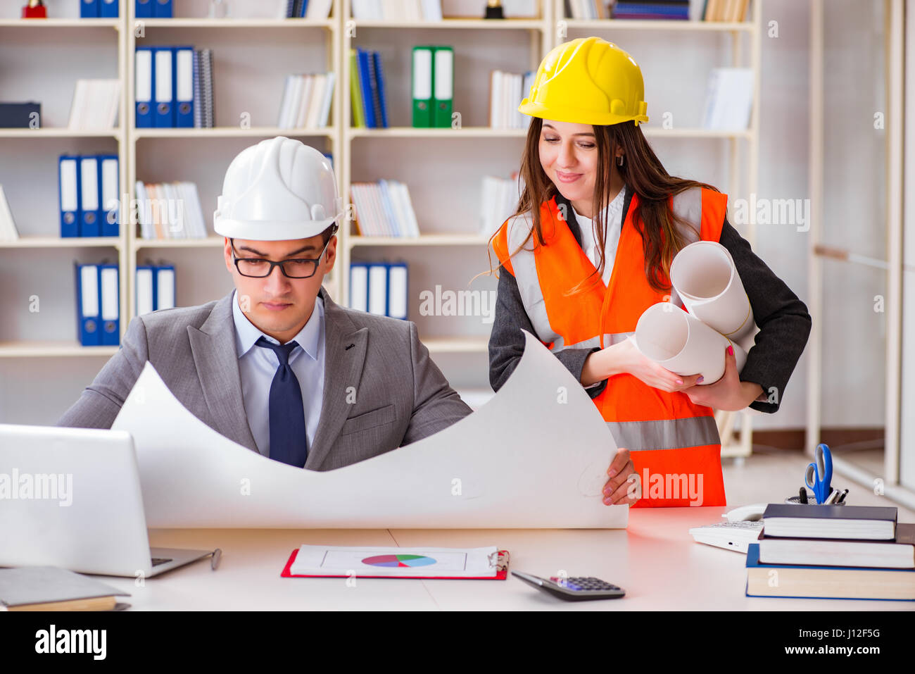 Construction foreman supervisor reviewing drawings Stock Photo - Alamy
