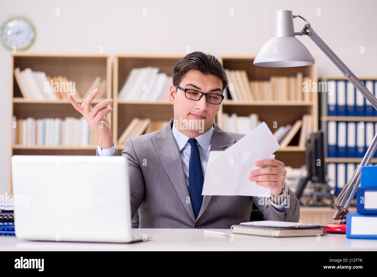 Businessman receiving letter in the office Stock Photo - Alamy