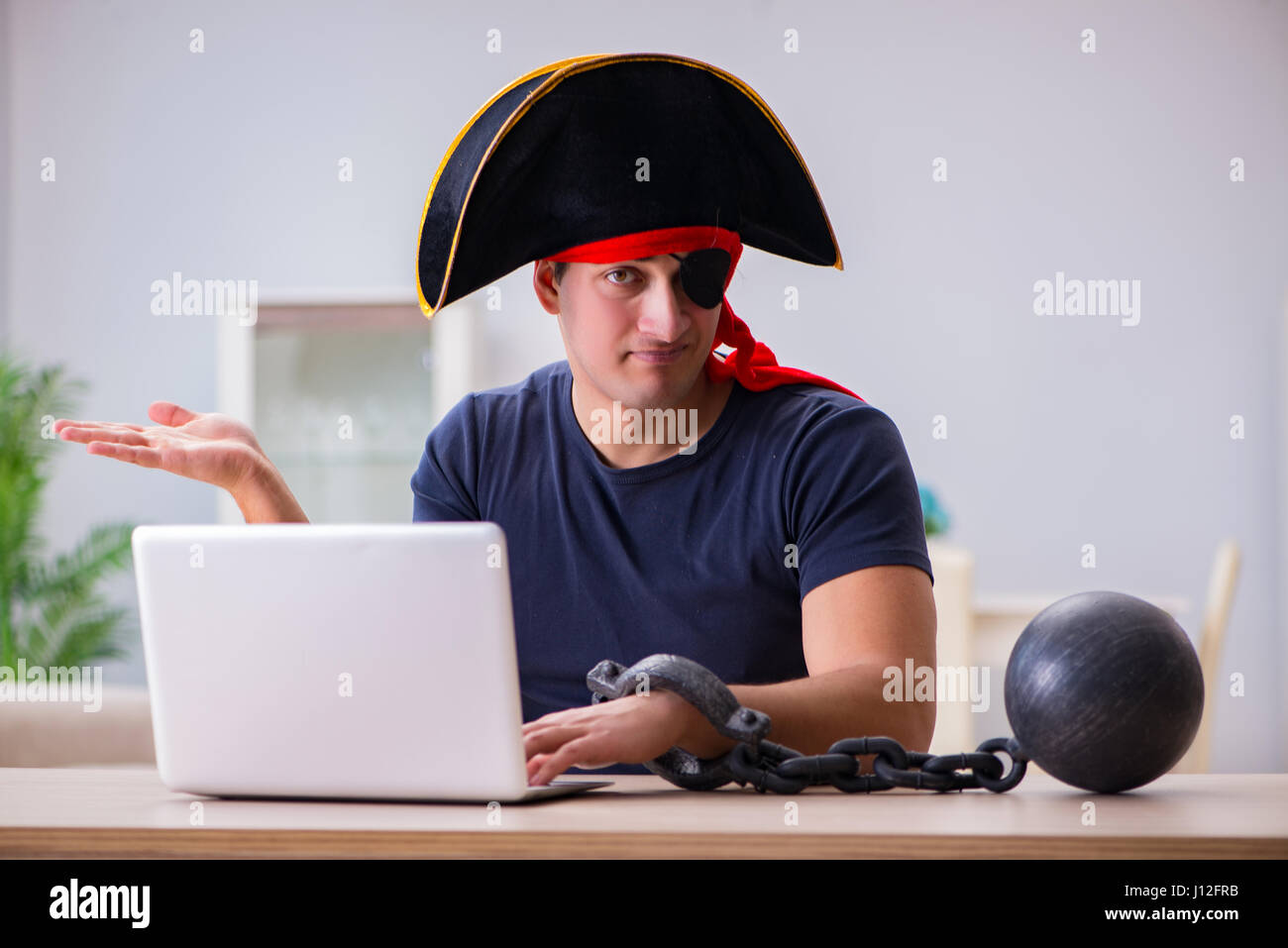 Digital security concept with pirate at computer Stock Photo - Alamy
