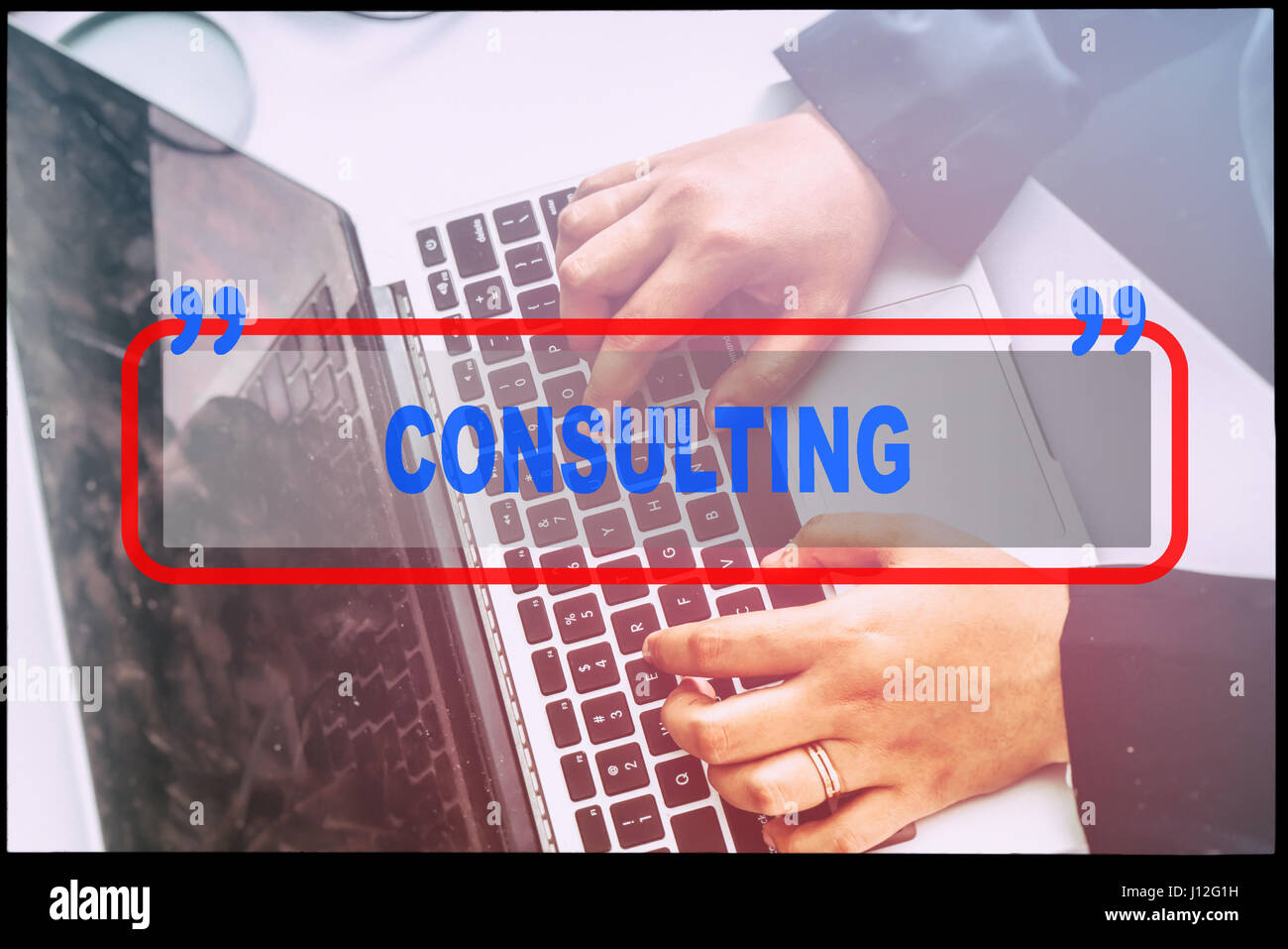 Hand and text "CONSULTING" with vintage background. Technology concept ...