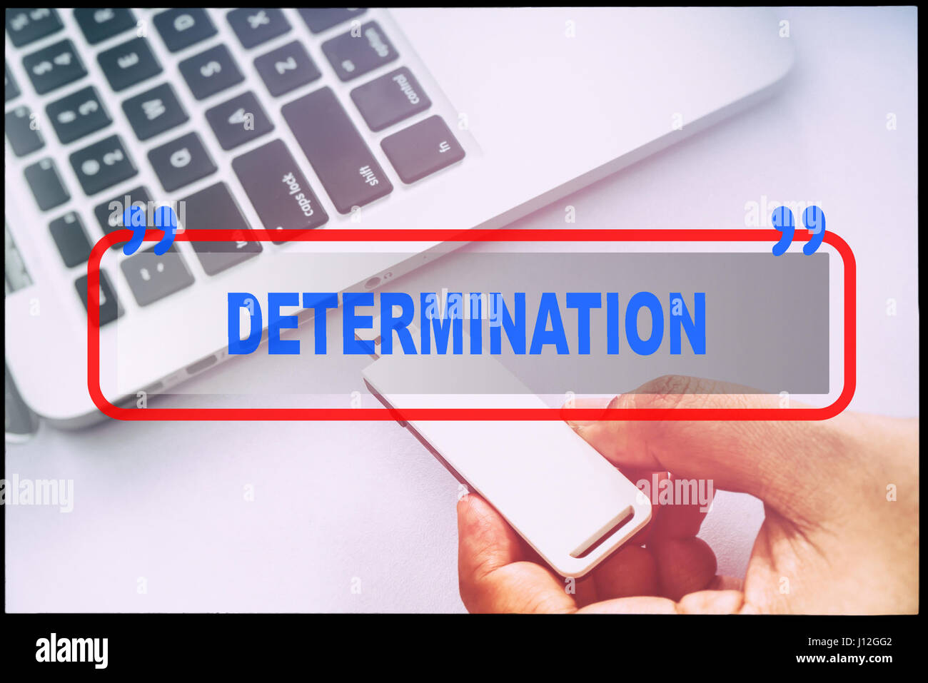 Hand and text "DETERMINATION" with vintage background. Technology ...