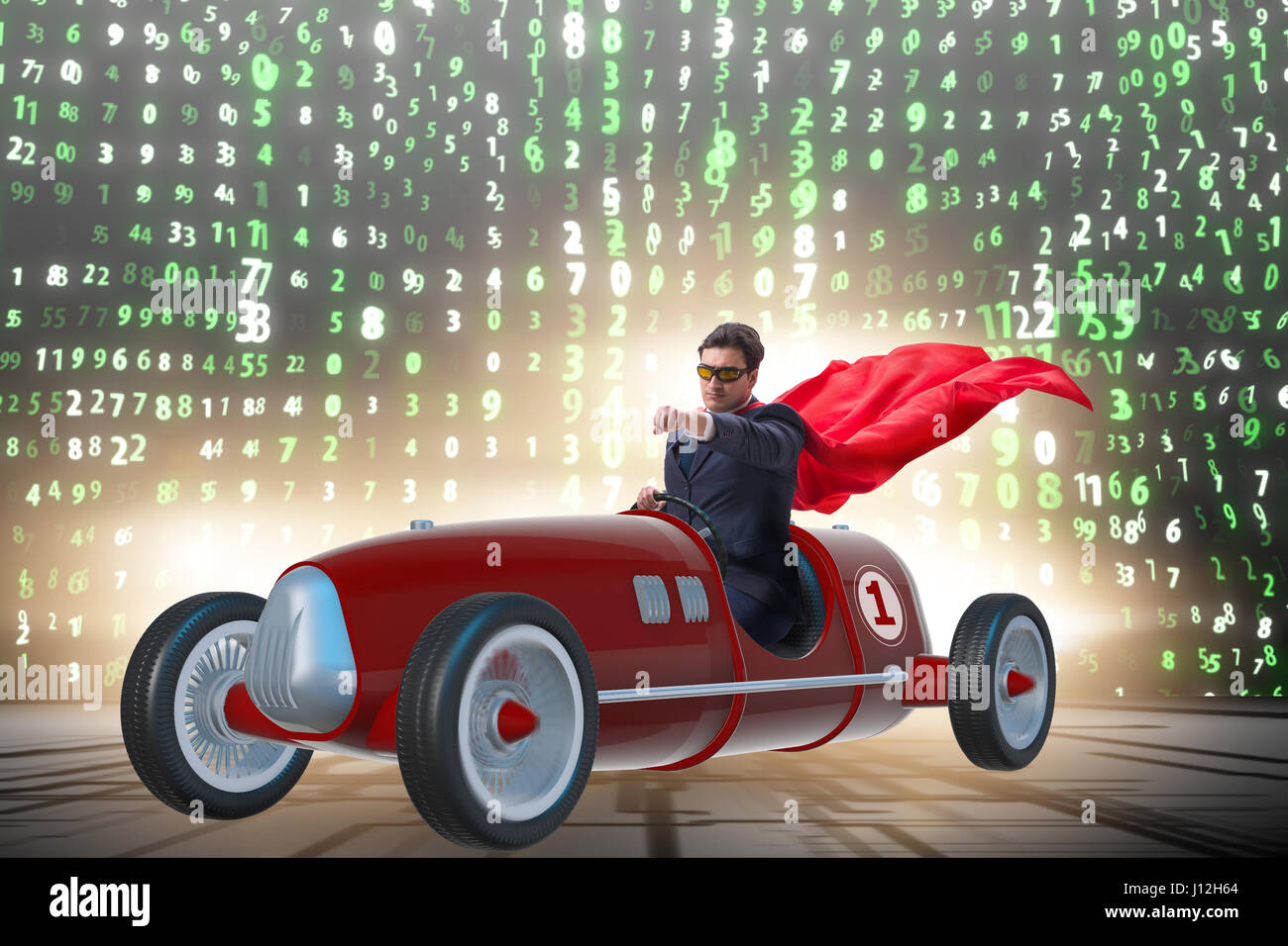 Superhero businessman driving vintage roadster Stock Photo - Alamy