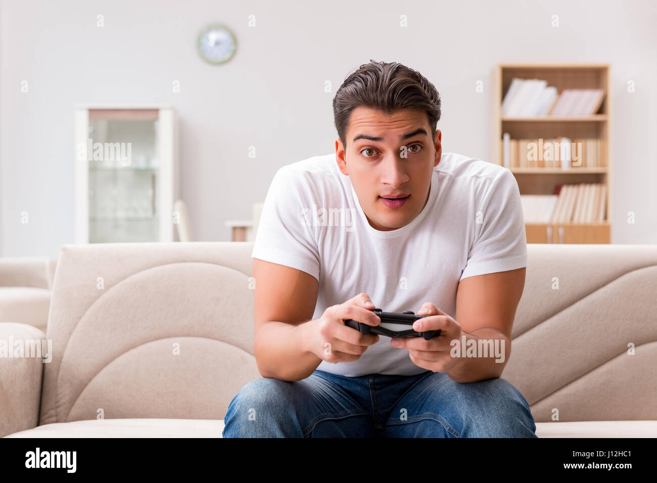 Man addicted to computer games Stock Photo - Alamy