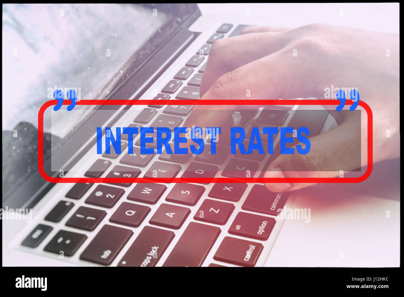 Hand and text "INTEREST RATES" with vintage background. Technology ...