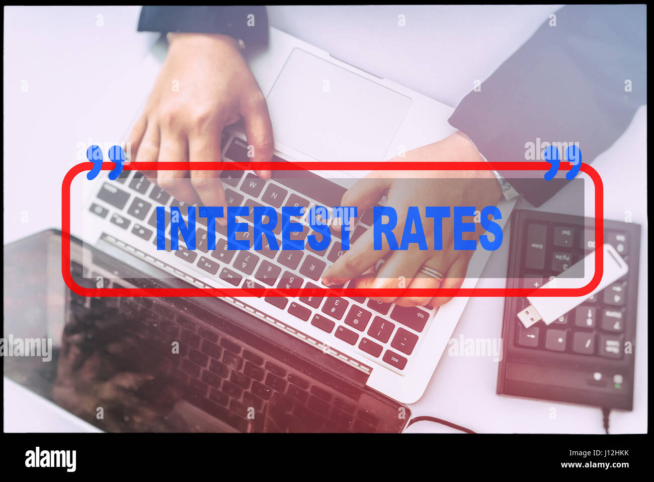 Hand and text "INTEREST RATES" with vintage background. Technology ...
