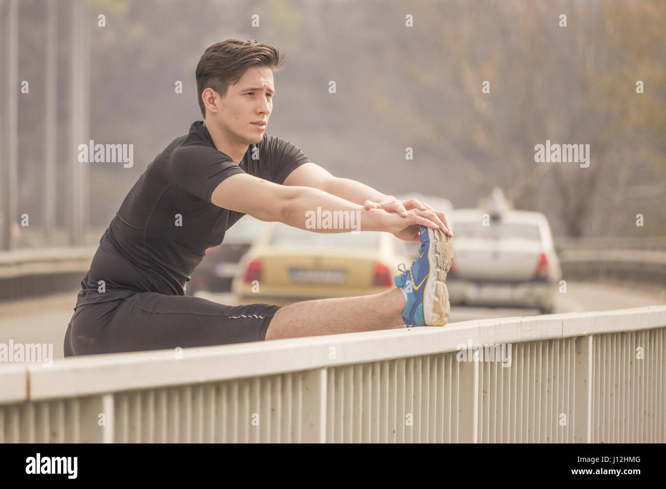 Man stretching leg on hi-res stock photography and images - Alamy