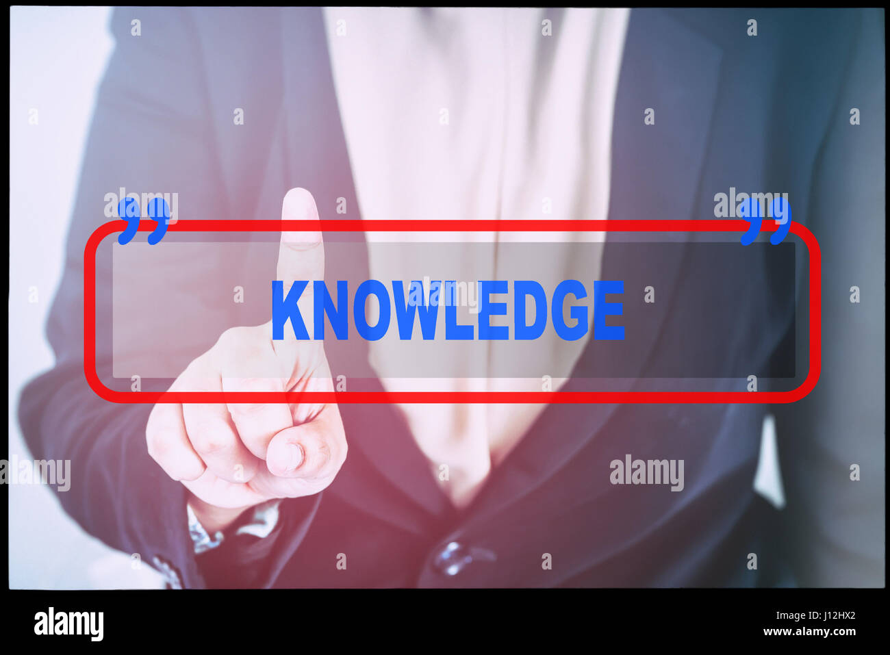 Hand and text "KNOWLEDGE" with vintage background. Technology concept ...