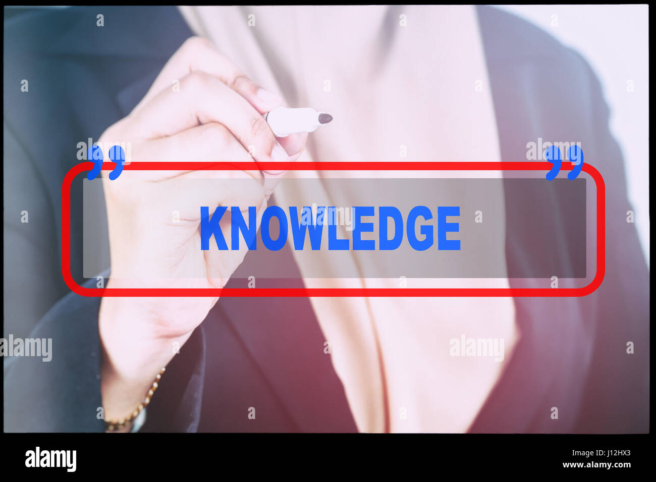 Hand and text "KNOWLEDGE" with vintage background. Technology concept ...