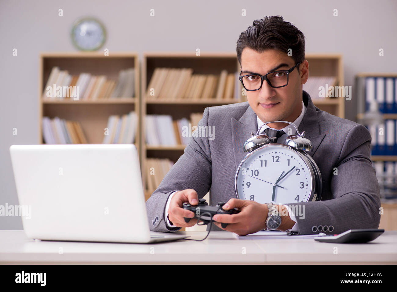 Businessman playing computer games at work office Stock Photo - Alamy