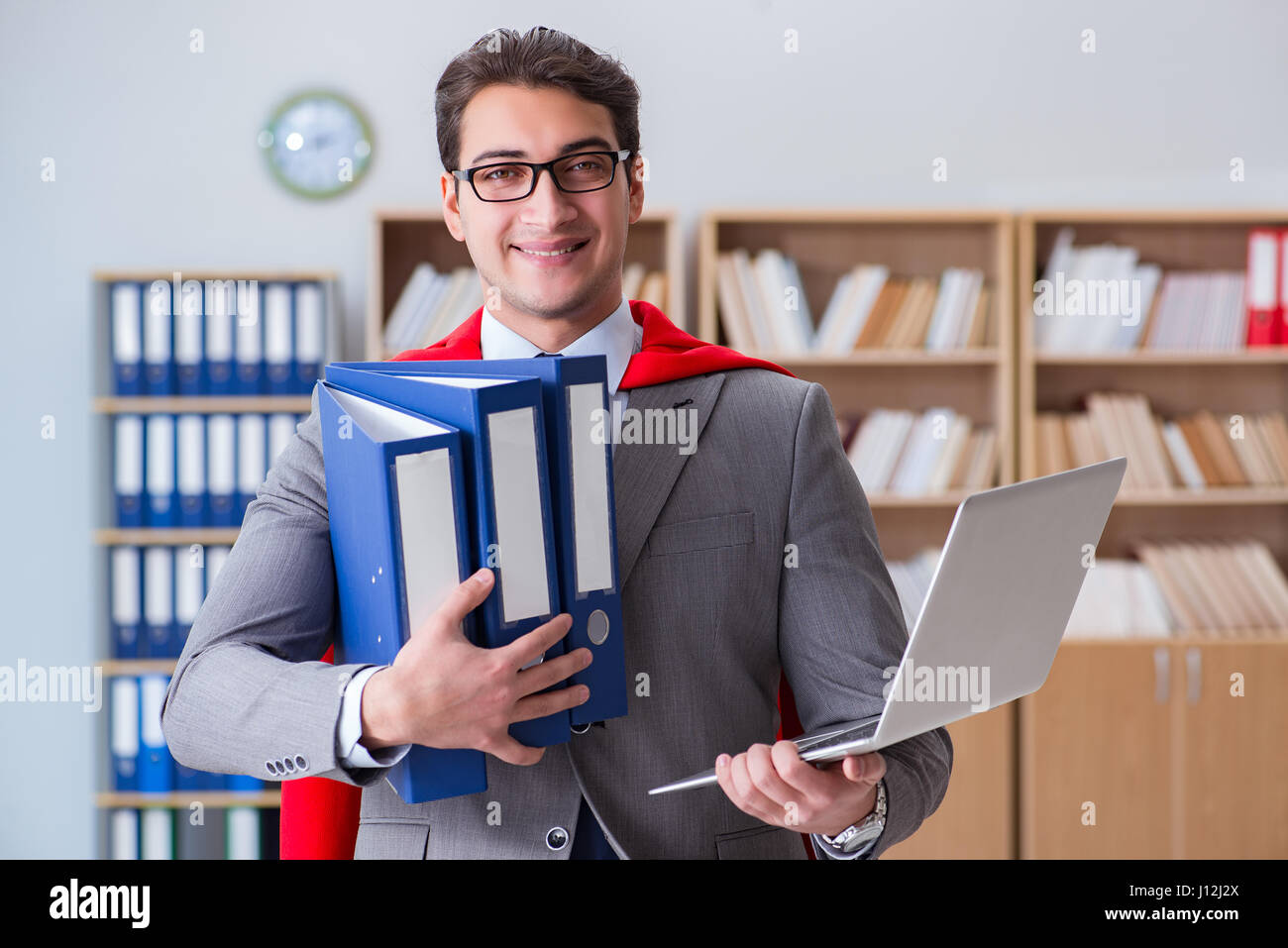 Superhero businessman working in the office Stock Photo - Alamy