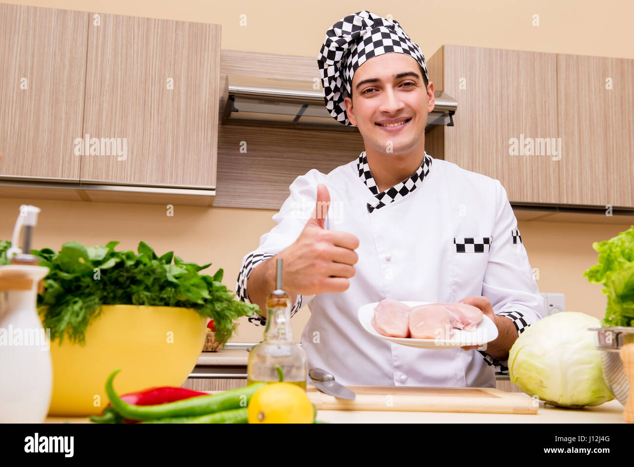 Young chef working in the kitchen Stock Photo - Alamy