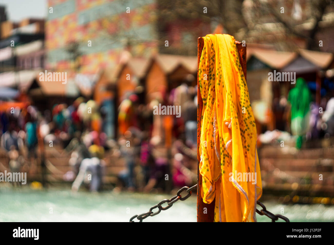 Saffron cloth is worn by holy individuals in Hinduism. Shot against the ...