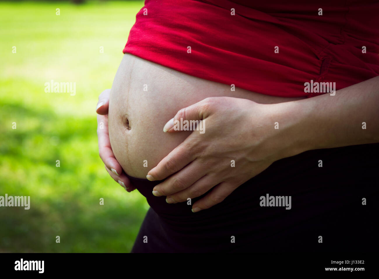 Red belly shirt hi-res stock photography and images - Alamy