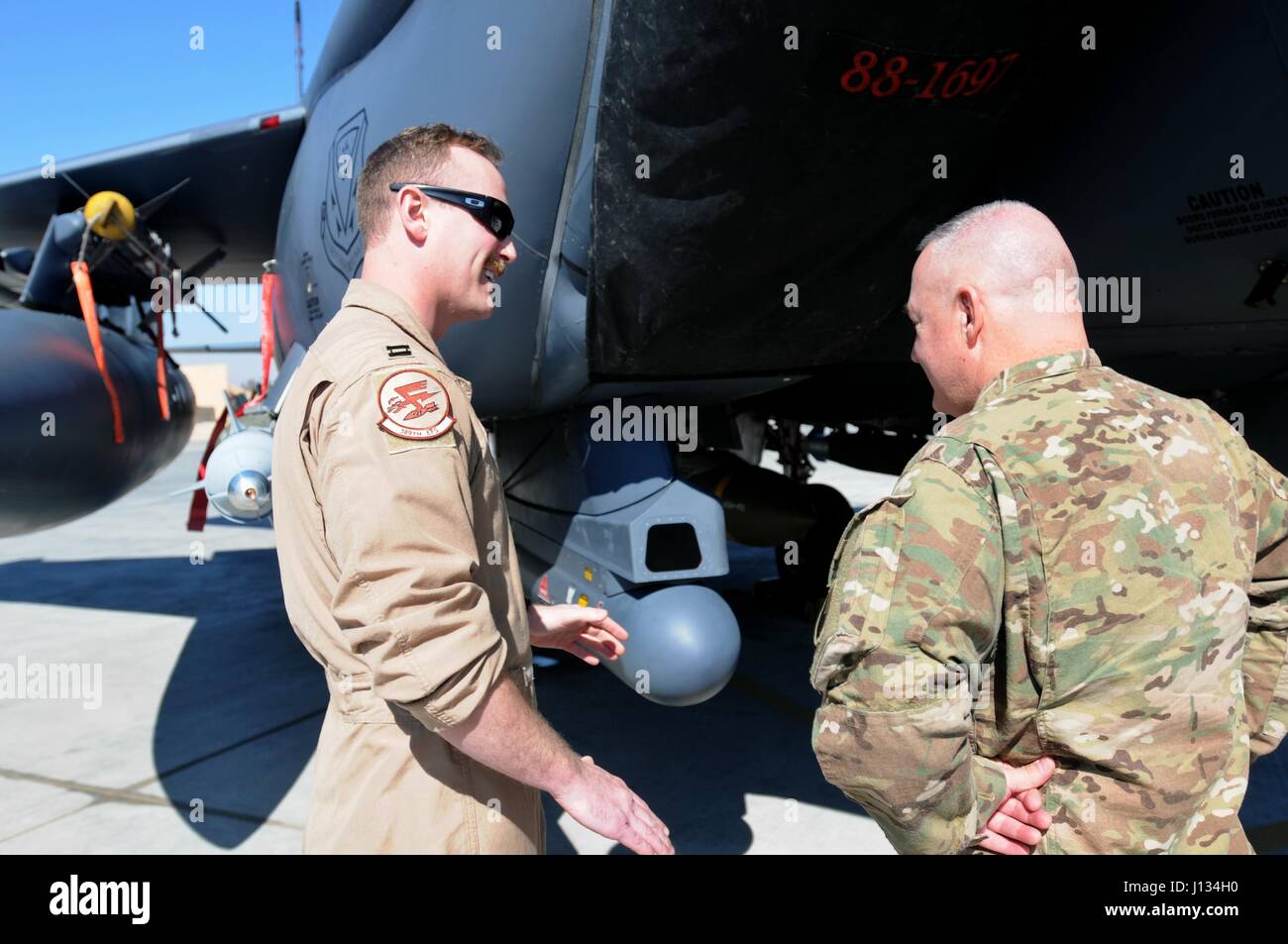 A pilot with the 332nd Air Expeditionary Wing shows Maj. Gen. Blake C ...