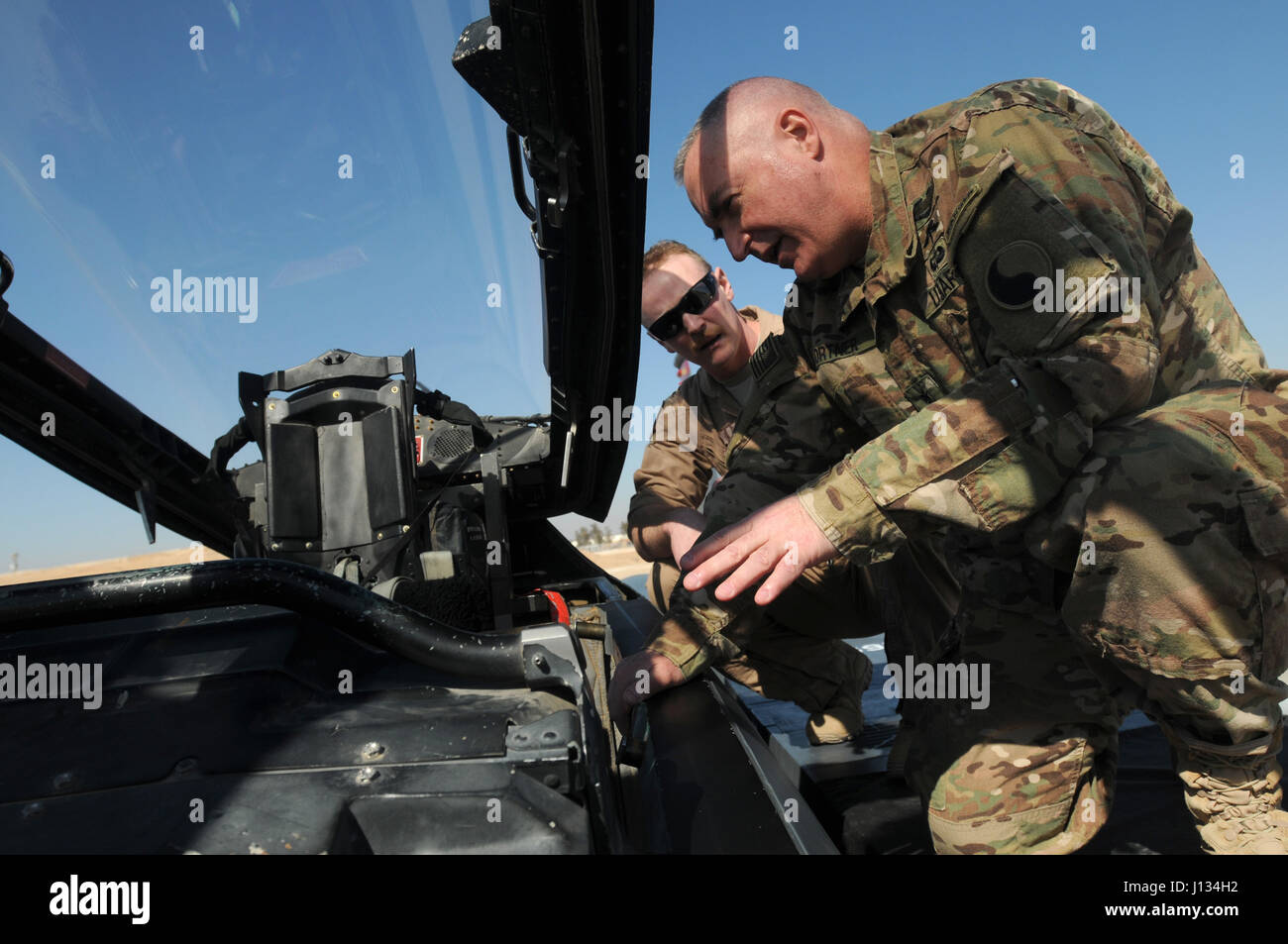 A pilot with the 332nd Air Expeditionary Wing shows Maj. Gen. Blake C ...