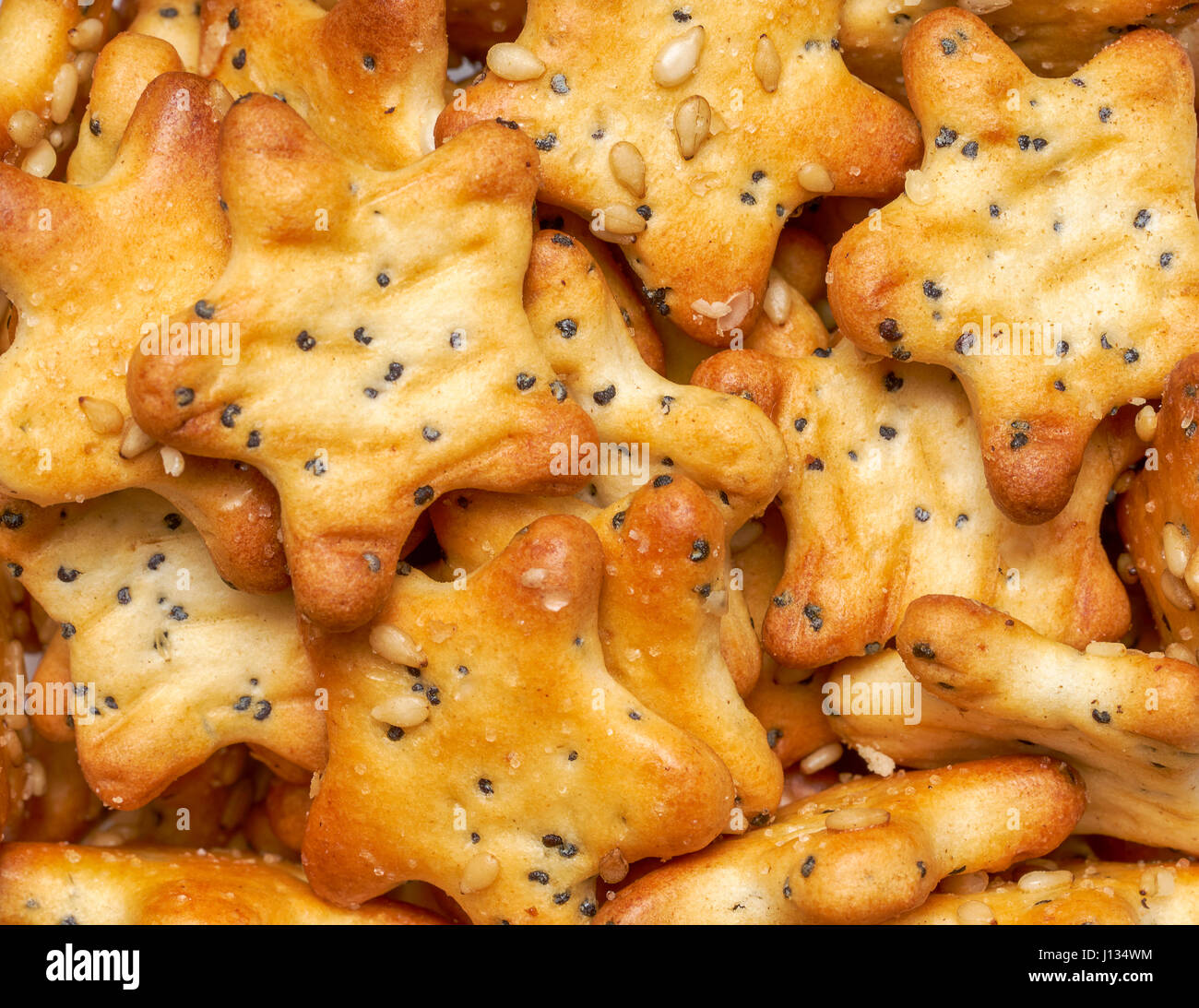 full frame closeupof some baked crisp salty snack pieces Stock Photo ...