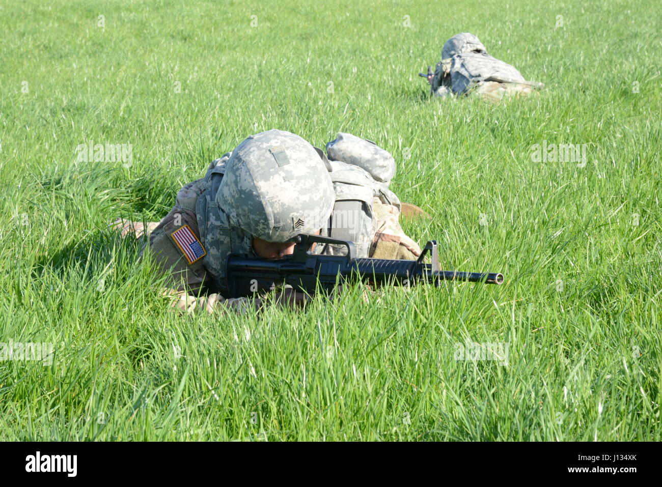 U.S. Army Sgt. assigned to the 39th Signal Battalion assumes a prone ...