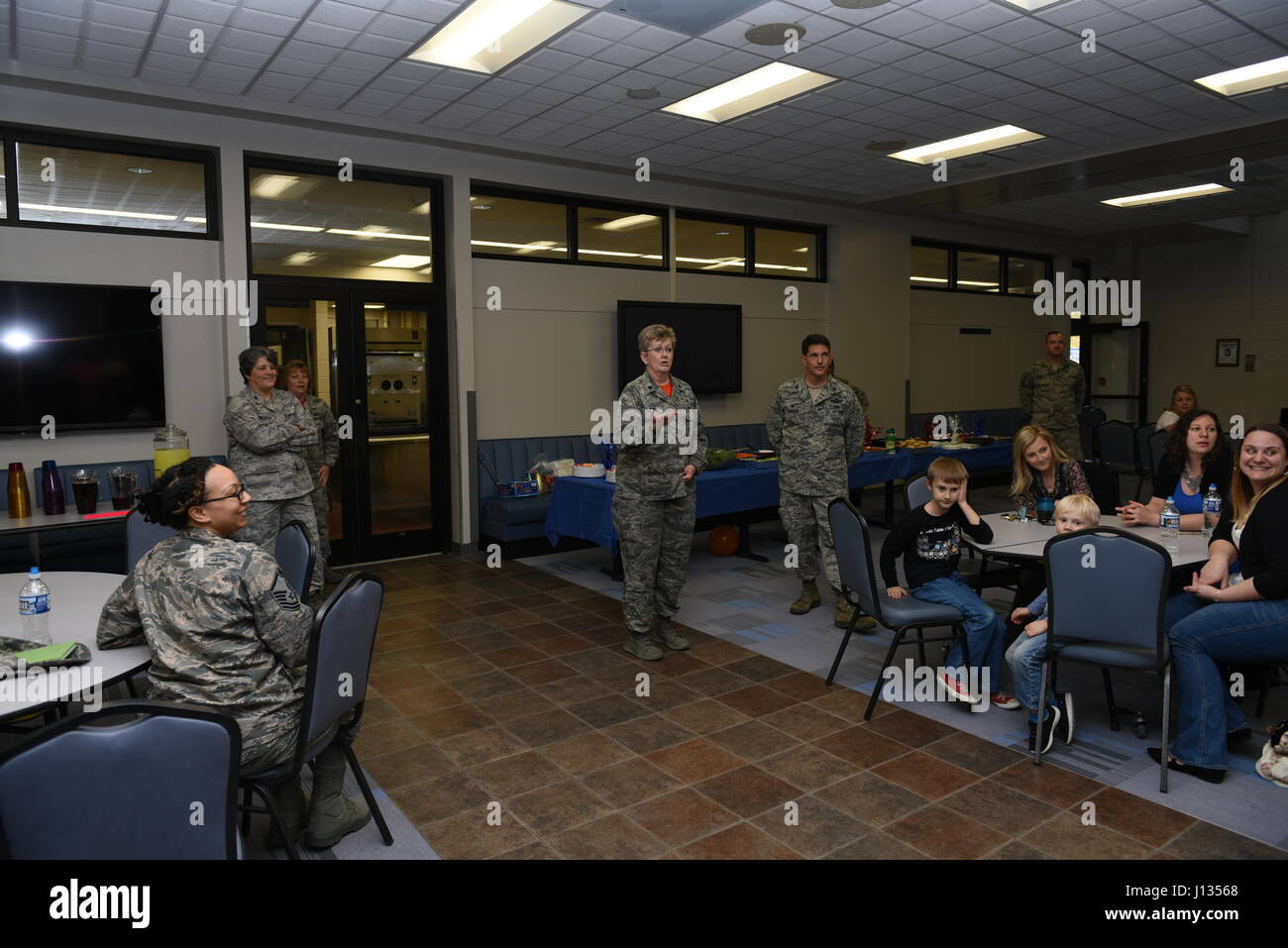 Air Force Chaplain Lt. Col. Debbie Kidd addresses family members of ...