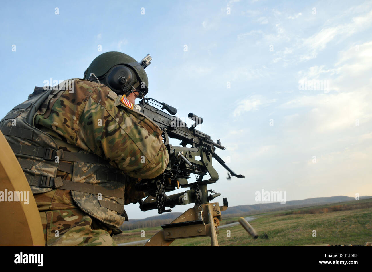 A U.S. Army Reserve Soldier engages targets with an M240B machine gun ...