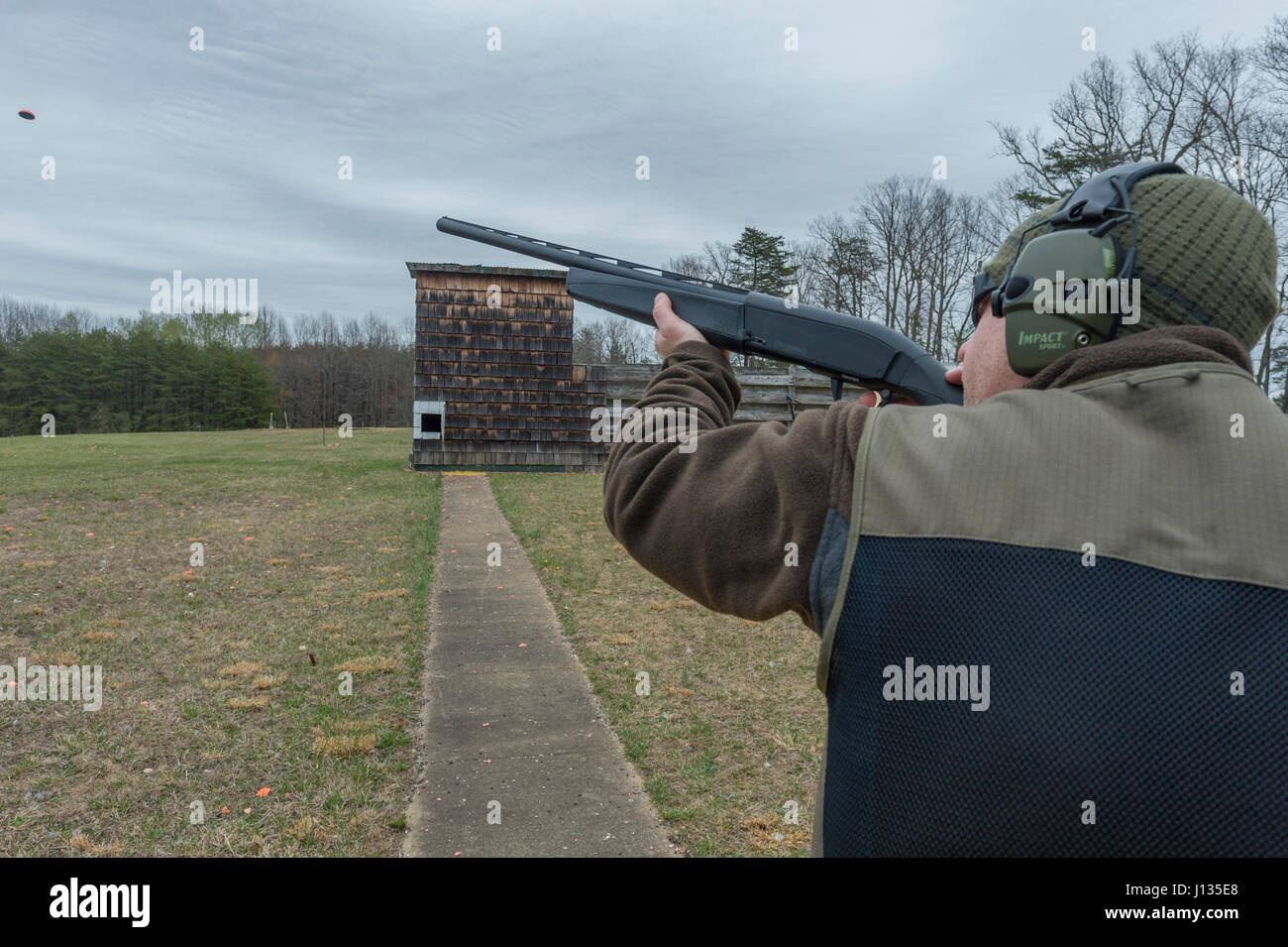 Ian Courtney fires a shotgun during a skeet shooting competition hosted ...