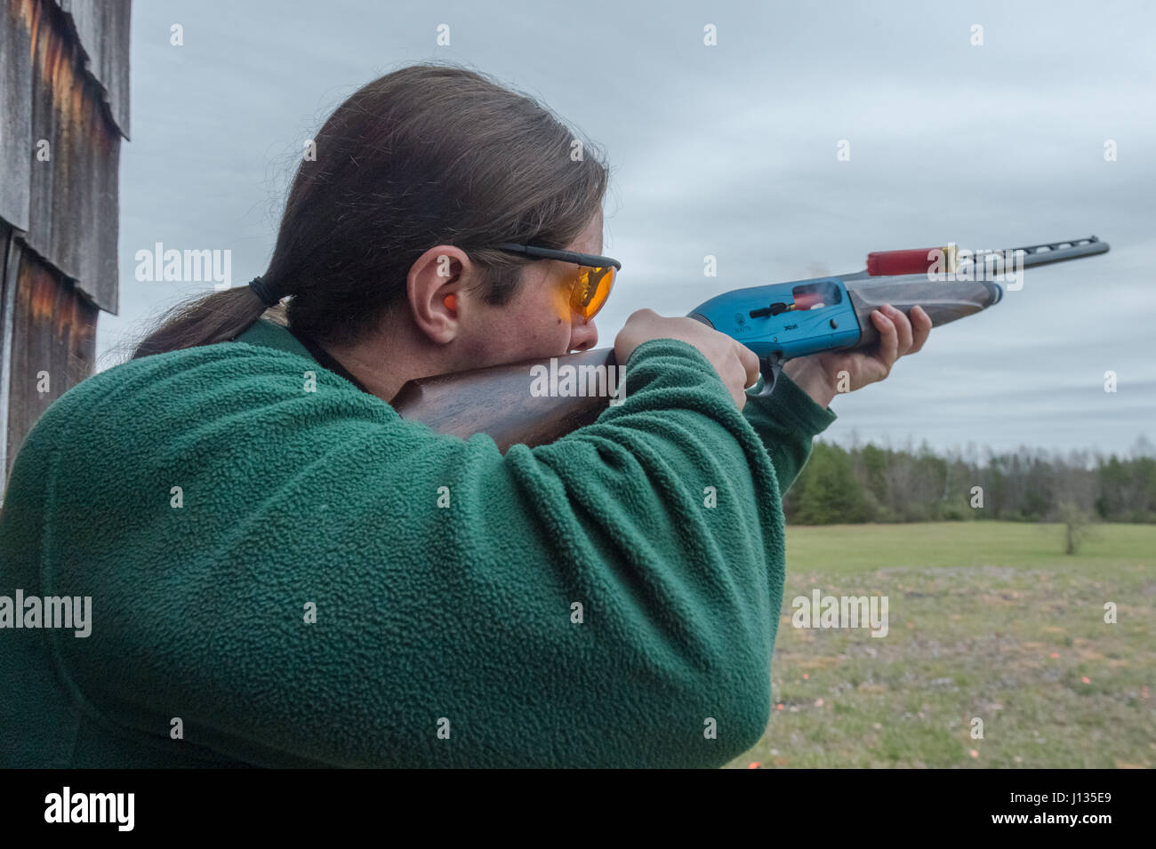 Jeff Madore fires a shotgun during a skeet shooting competition hosted ...