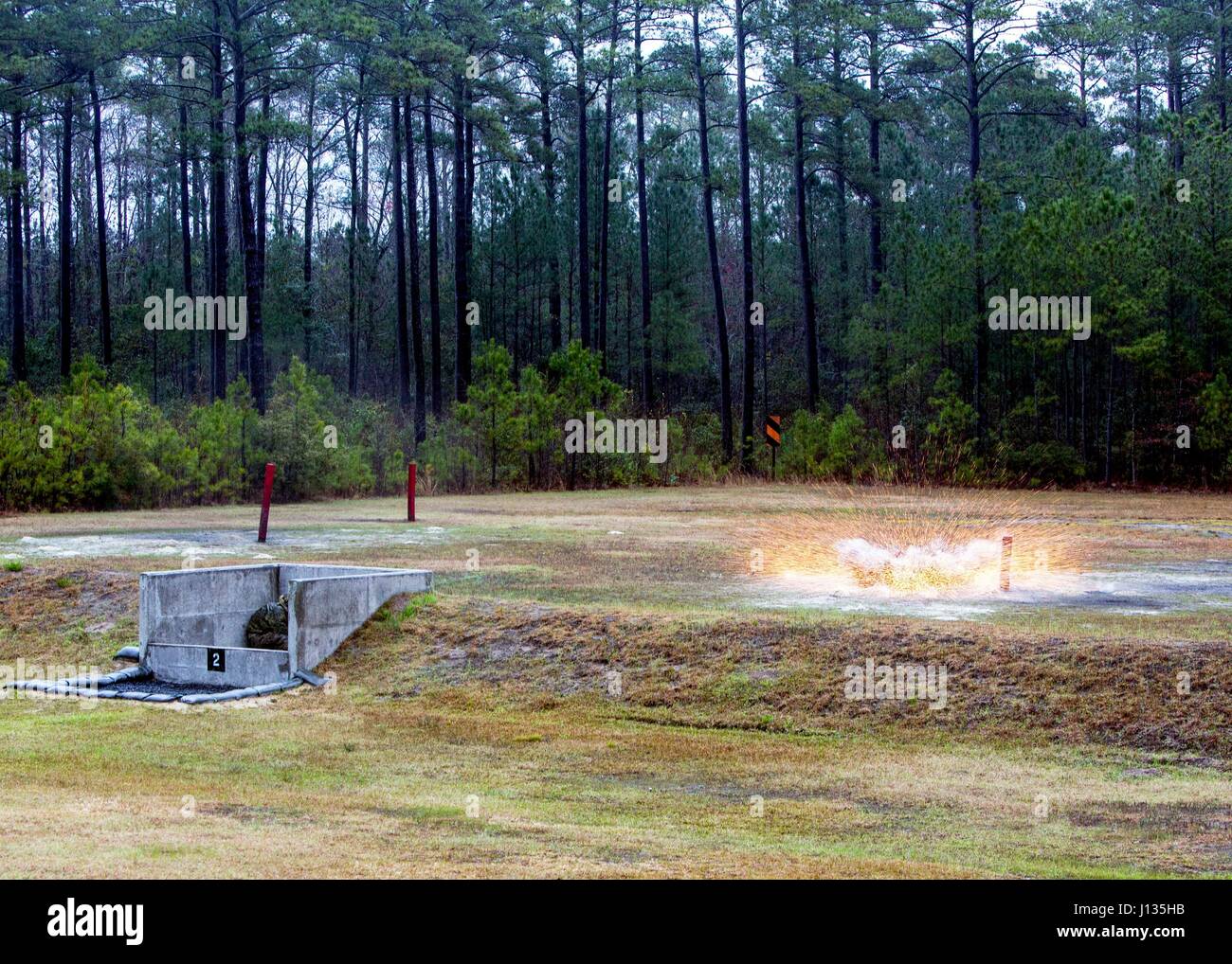 Marines take cover after throwing an M67 fragmentation grenade during a ...