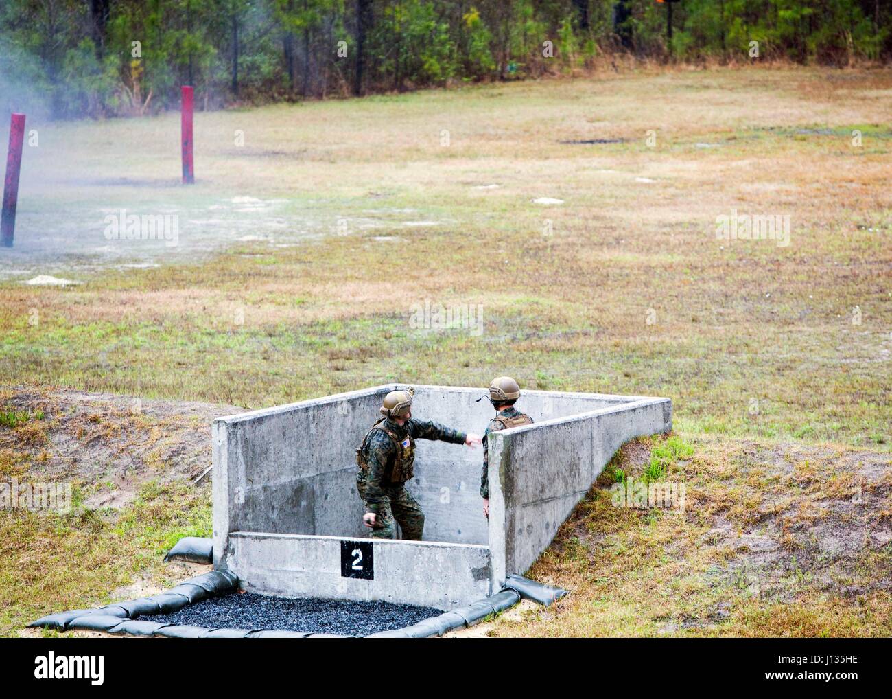 A Marine throws an M67 fragmentation grenade during a grenade range at ...
