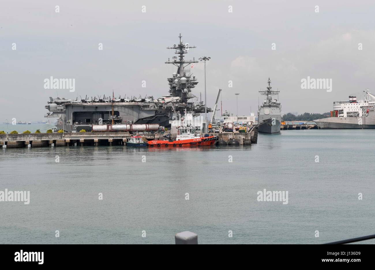 USS Wayne E. Meyer (DDG 108), an Arleigh Burke-class destroyer, moors ...