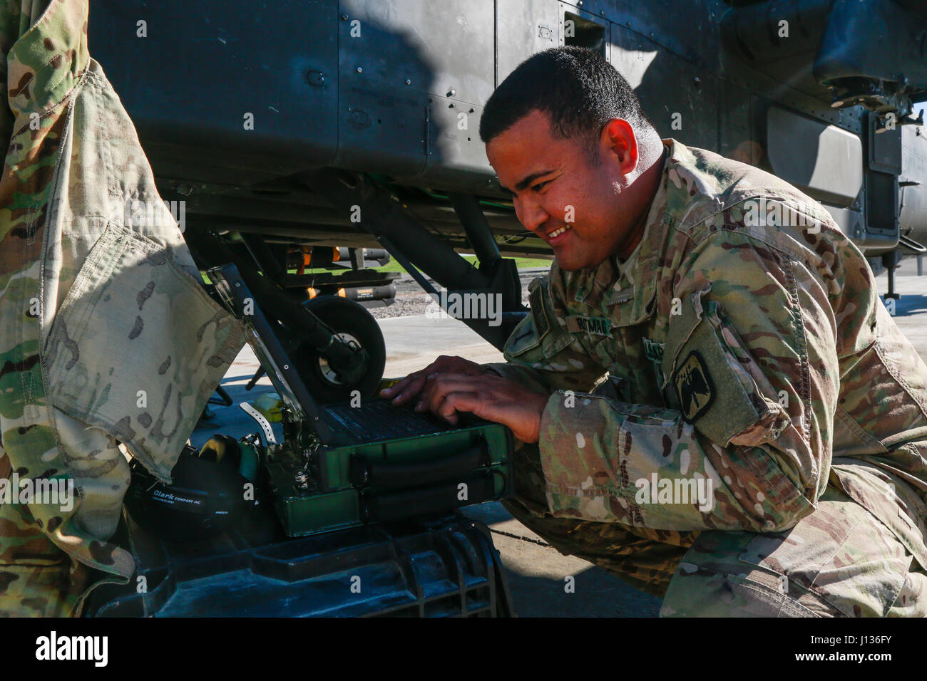 U.S. Army Sgt. Cyril Rutmag, an AH-64E Apache helicopter maintenance ...