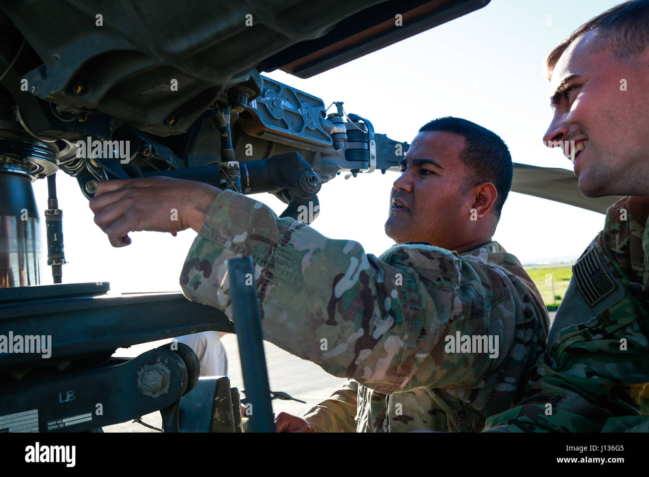 U.S. Army Sgt. Cyril Rutmag, left, and Pfc. Codey Herman, AH-64E Apache ...