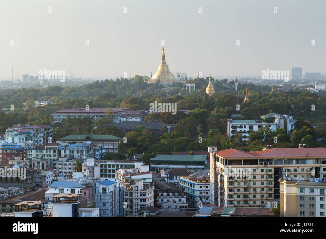 View of Yangon, Myanmar, from above in daylight and golden Shwedagon ...