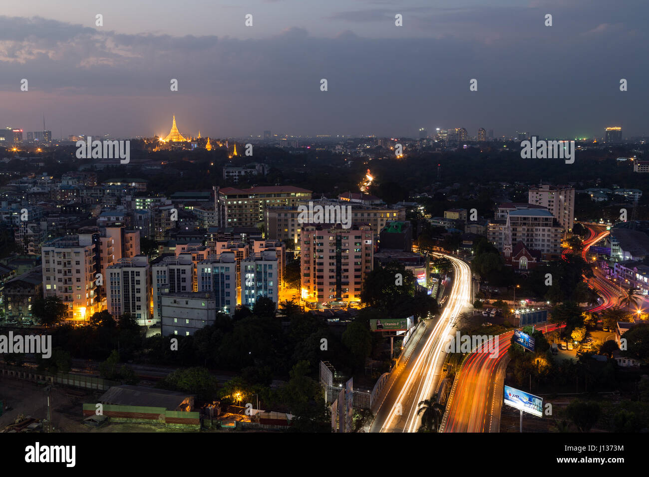 View of Yangon, Myanmar, from above in the evening. Lit Shwedagon ...