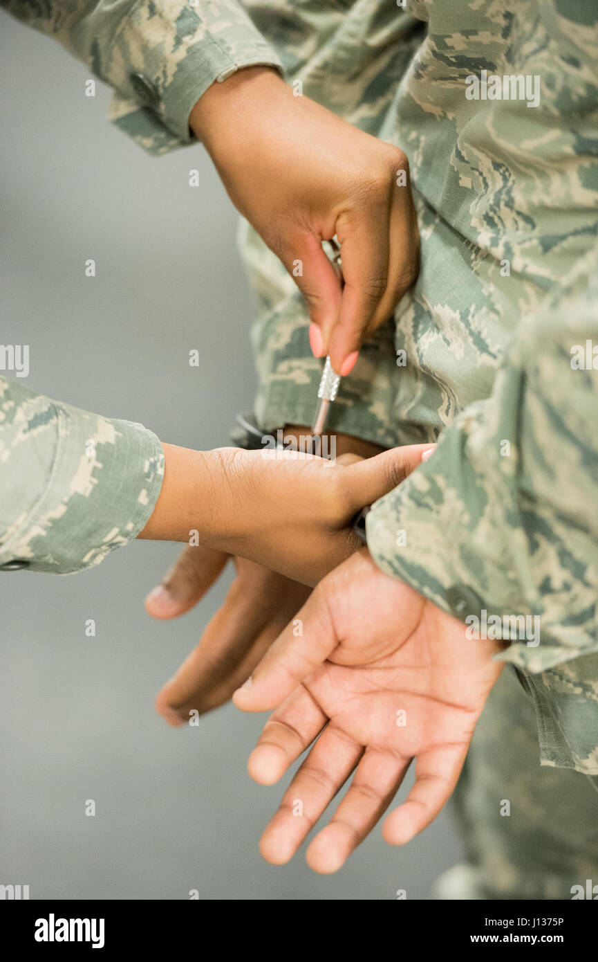 Members of 436th Security Forces Squadron practice proper handcuffing ...