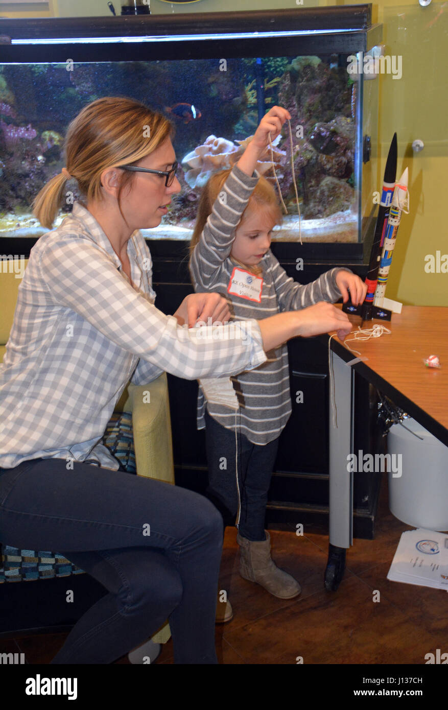 Researchers conduct STEM outreach activities for families during the ...