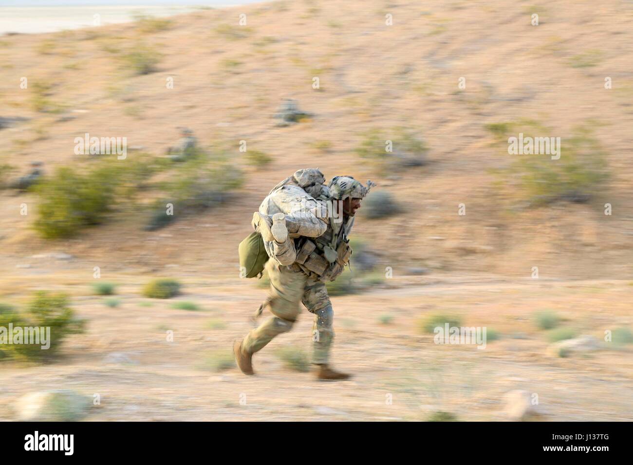 U.S. Army Soldier of 1st Battalion, 30th Infantry Regiment, carry a ...
