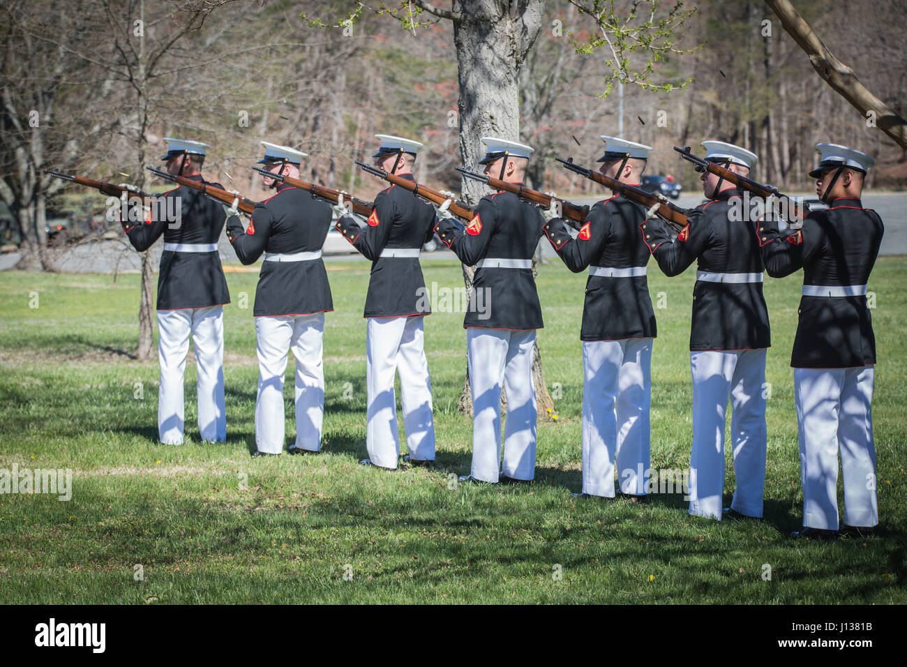 U.S. Marines with Marine Barracks Washington fire a three-volley salute ...