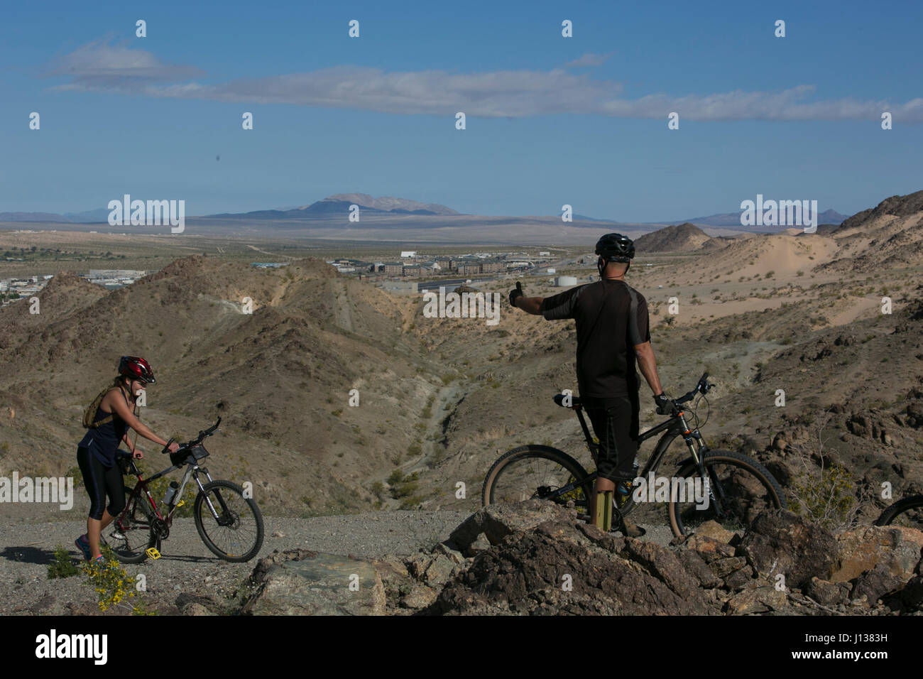 A participant motives a fellow cyclist the annual Earth Day Bike ride ...