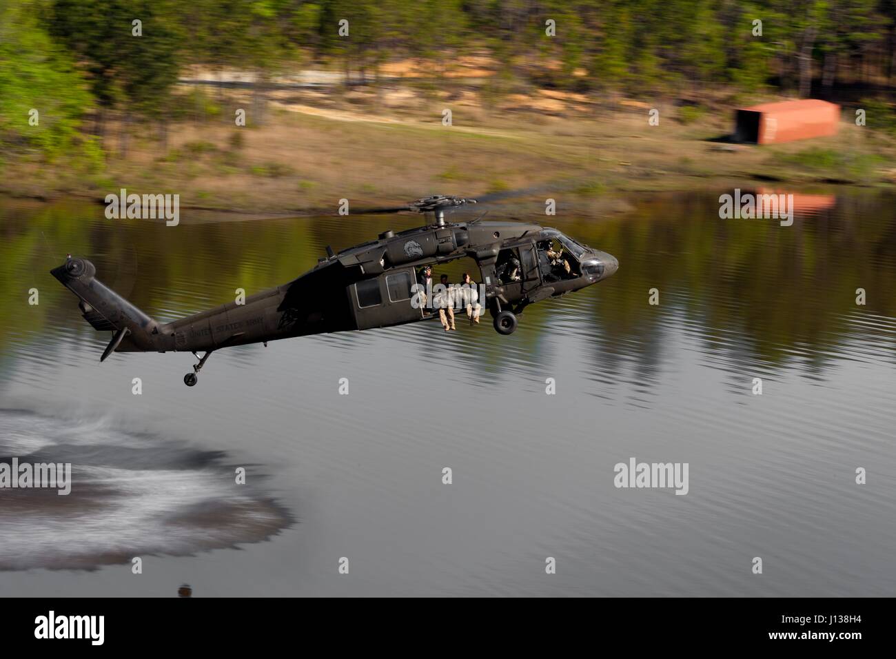 U.S. Army Rangers perform a helocast water insertion technique during ...