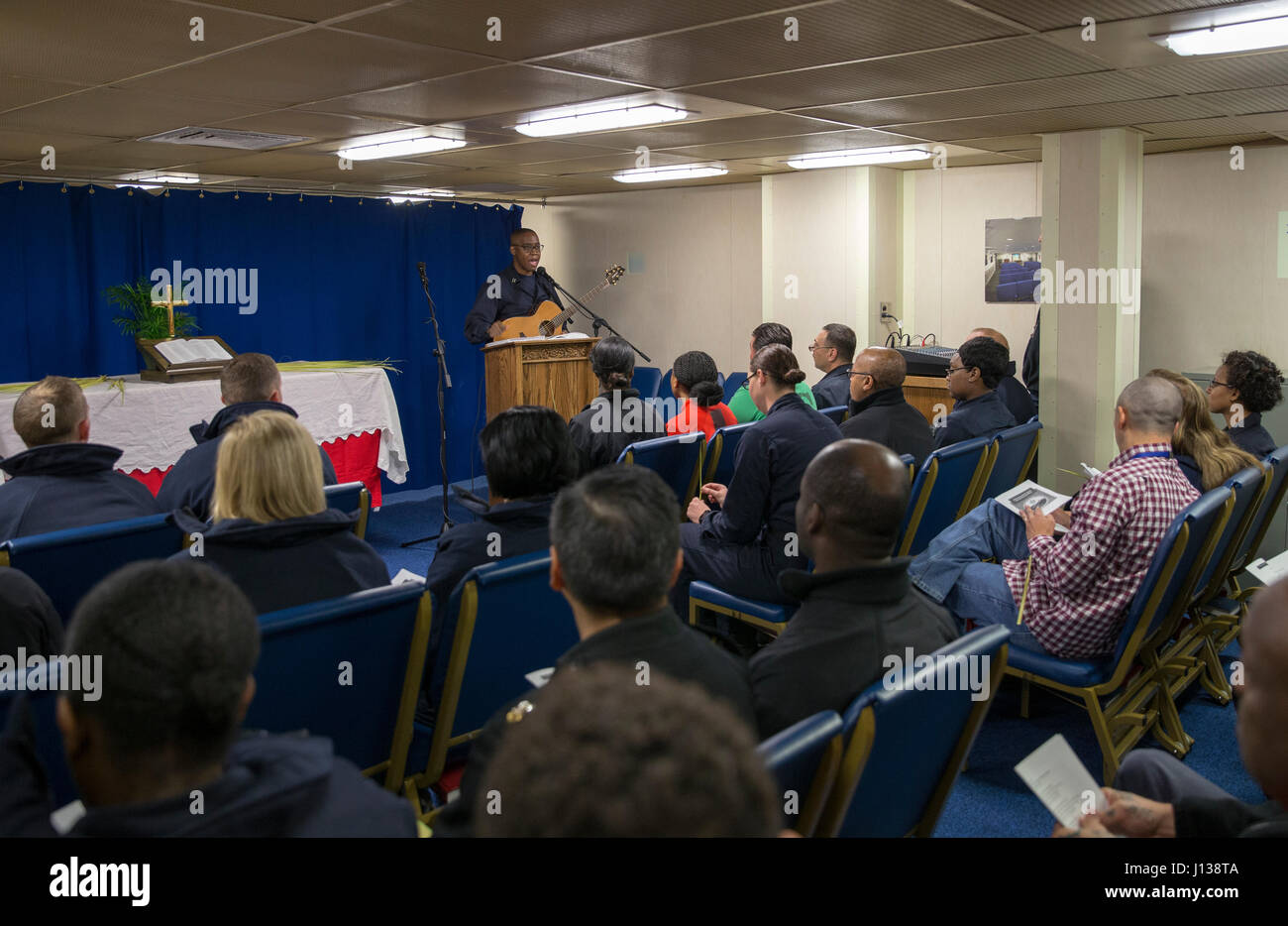 Chaplain aboard aircraft carrier hi-res stock photography and images ...