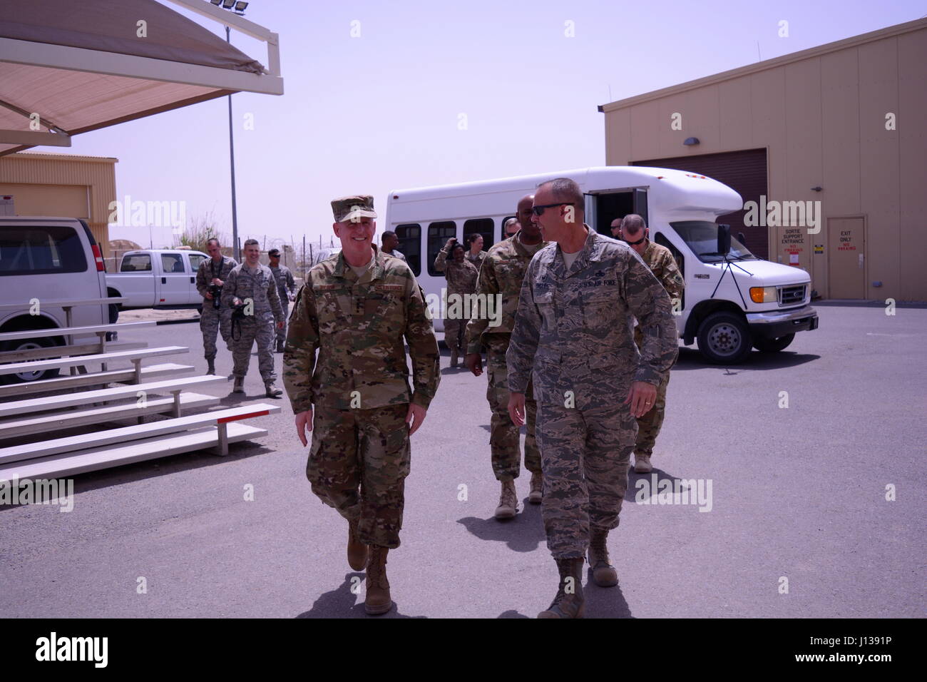 General Stephen W. "Seve" Wilson (left) walks beside Air Force Colonel ...