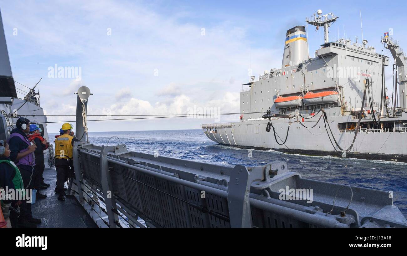 Sailors aboard USS Wayne E. Meyer receive fuel from USNS Pecos during a ...