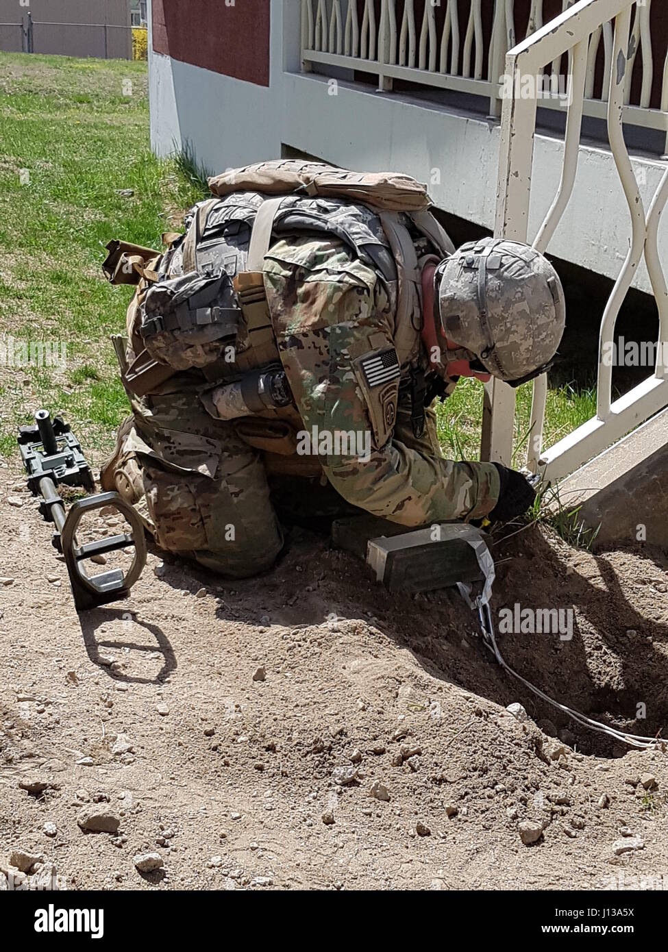 Staff Sgt. Kyle McFarland prepares to disarm a simulated improvised ...