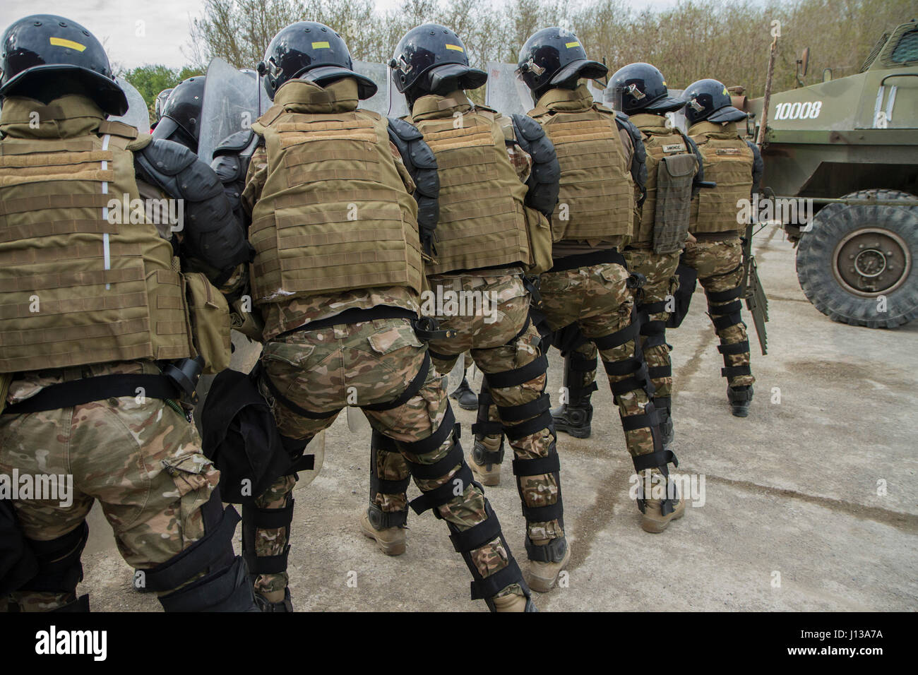 KFOR soldiers from Slovenia demonstrate crowd riot control techniques ...