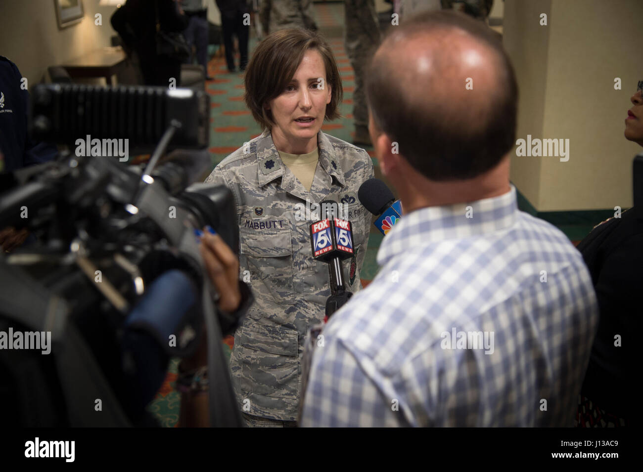 Lt. Col. Lisa Mabbutt, 11th Civil Engineer Squadron commander, speaks to media during a town ...
