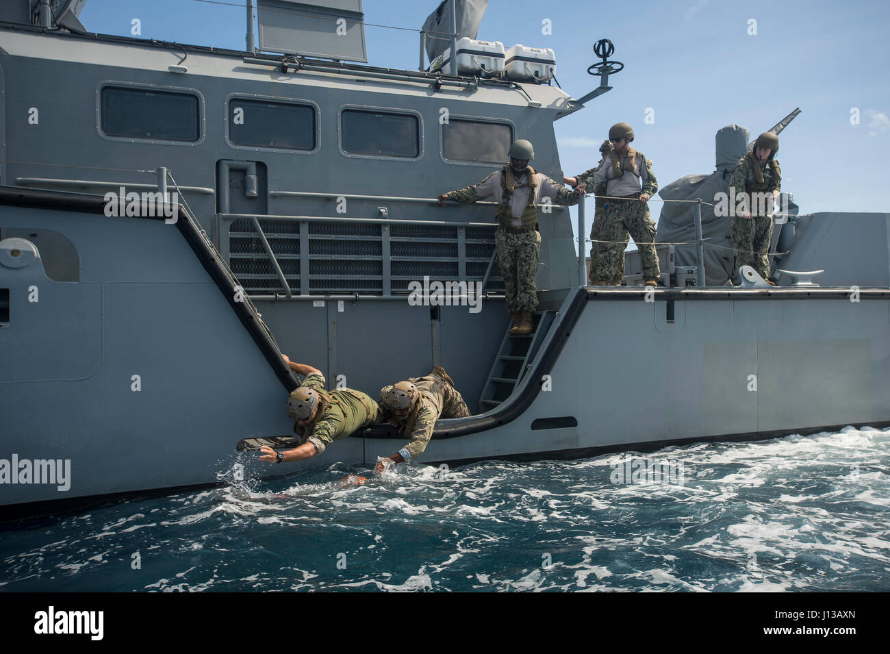 Sailors assigned to Explosive Ordnance Disposal Mobile Unit (EODMU) 5 ...