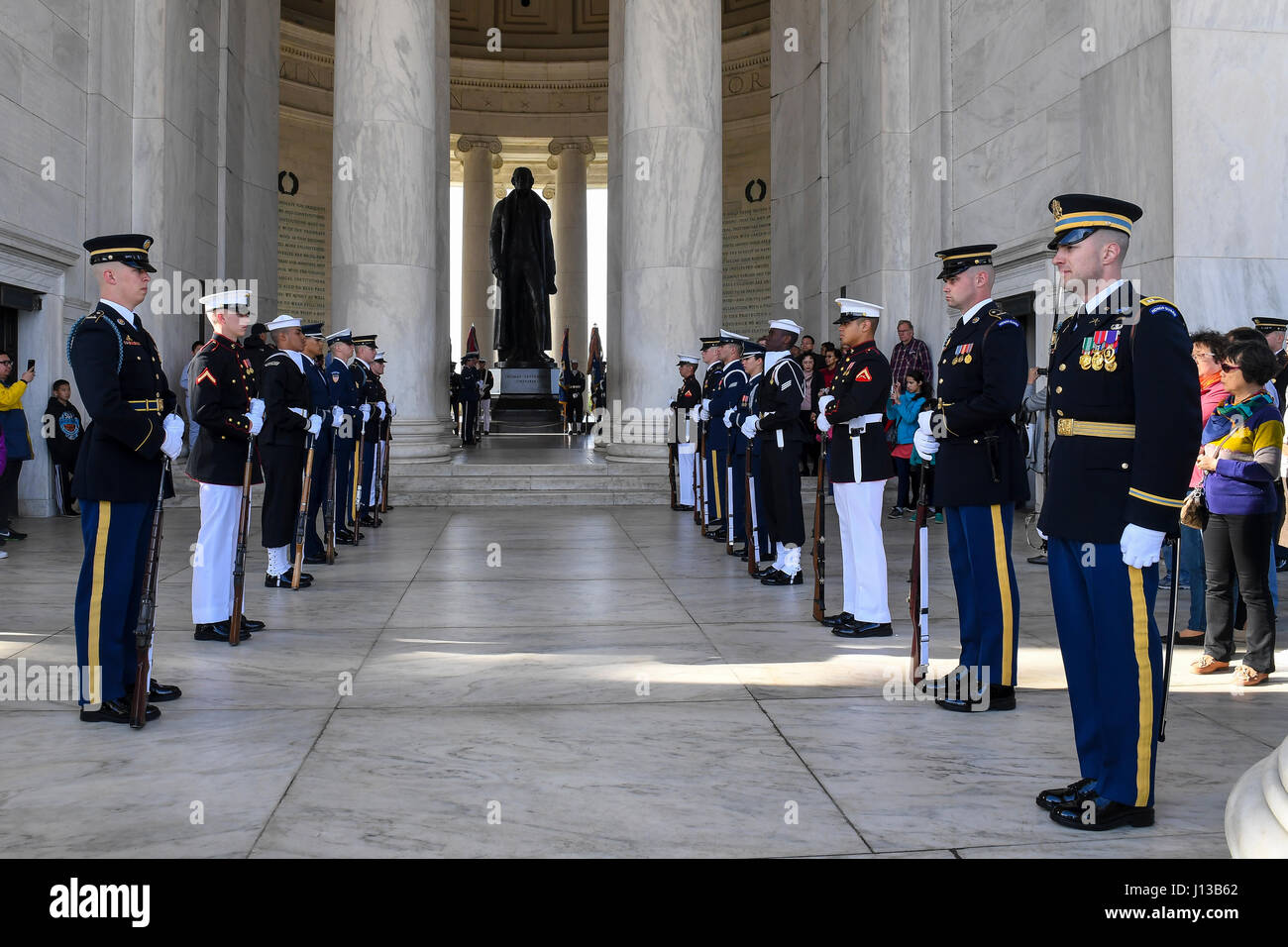 A joint armed forces honor guard participates in a wreath laying ...