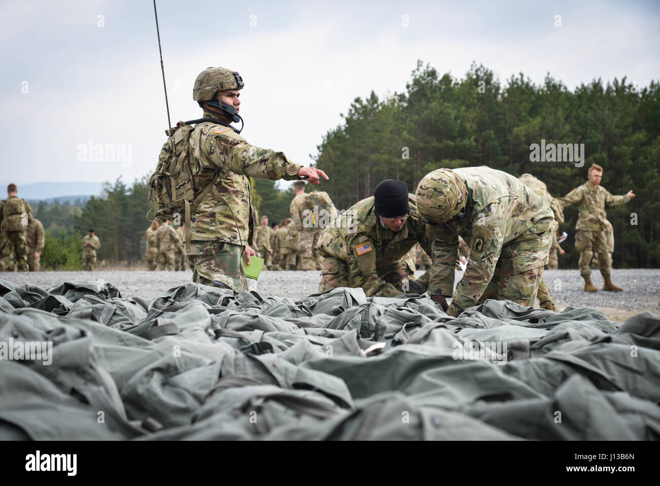 U.S. Army Paratroopers assigned to 4th Battalion, 319th Airborne Field Artillery Regiment, 173rd ...
