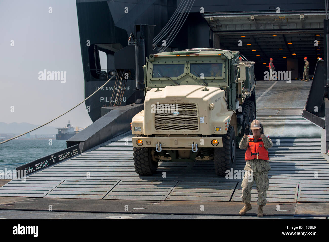 U.S. Marines, Sailors, and Coast Guardsmen aboard the USNS Pililaau ...