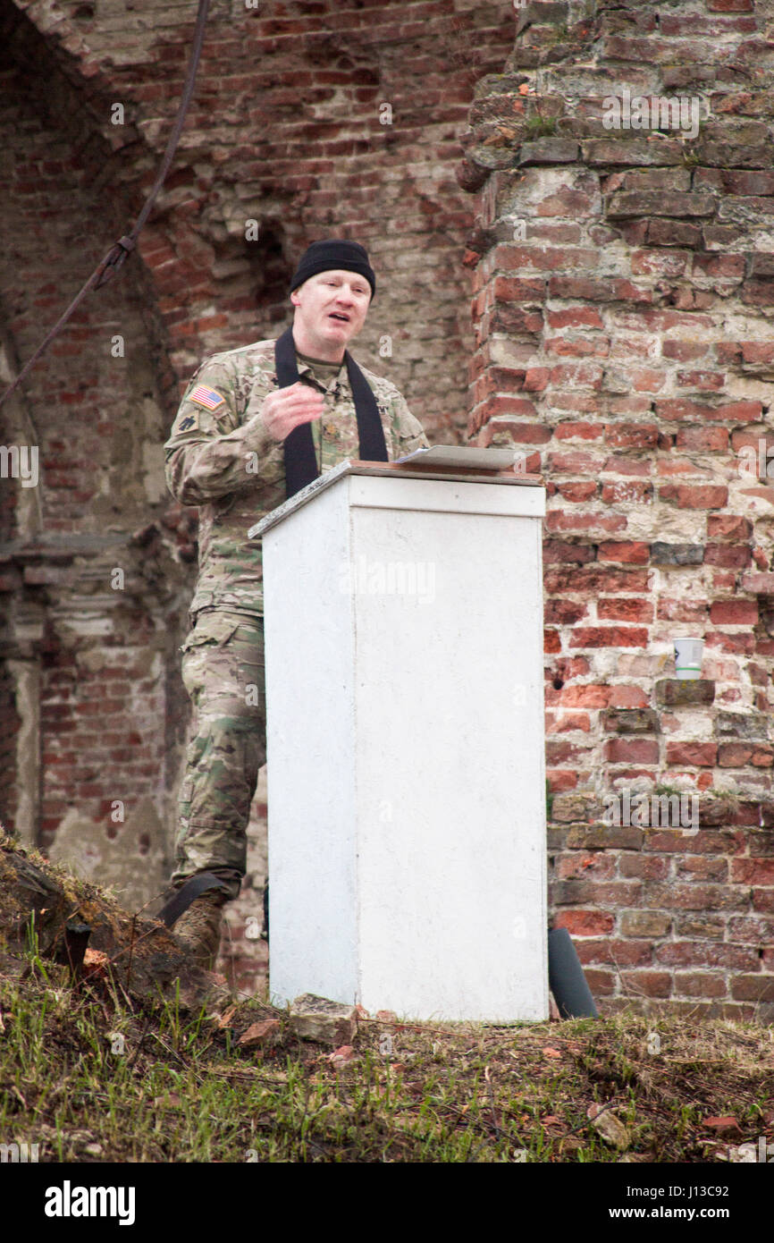A chaplain addresses U.S. and Canadian servicemembers during an Easter ...