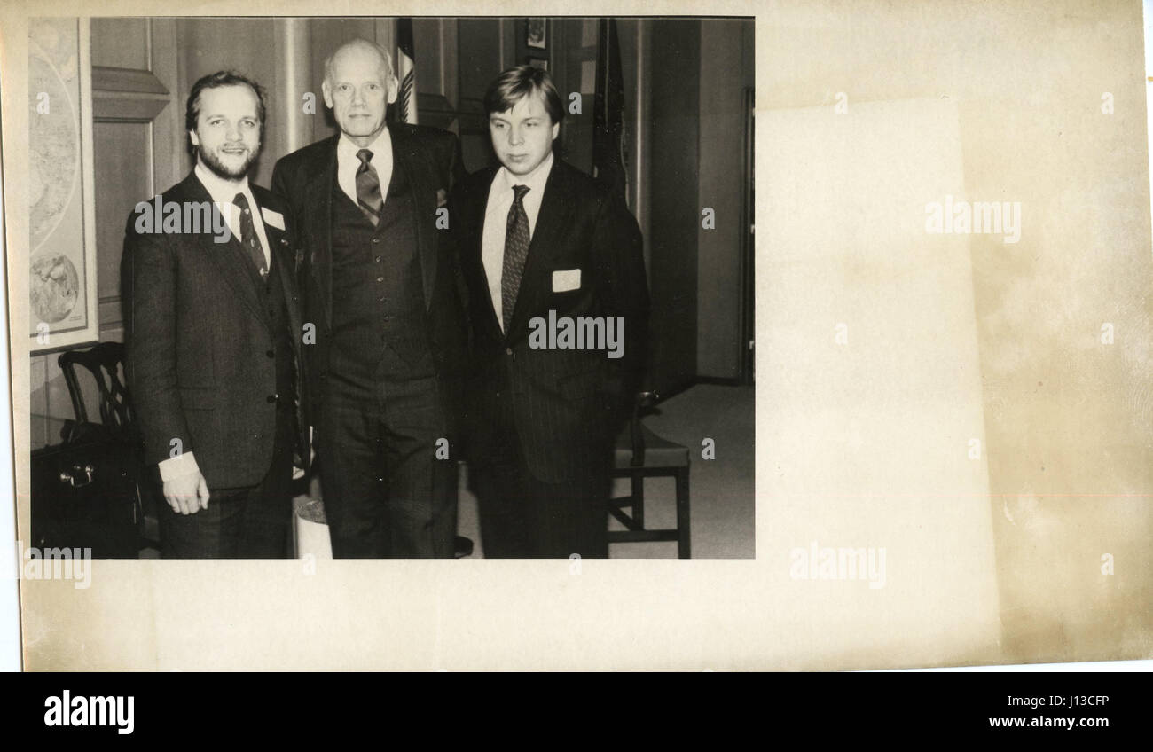 THREE MEN STANDING TOGETHER TAKING A PICTURE IN THE OFFICE Stock Photo ...